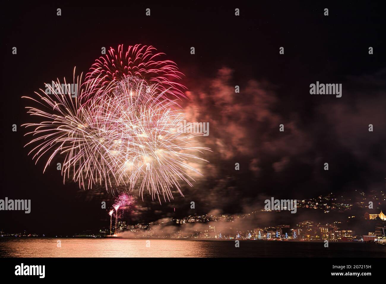 Wellington, New Zealand. 10th July, 2021. Fireworks light up the sky to ...