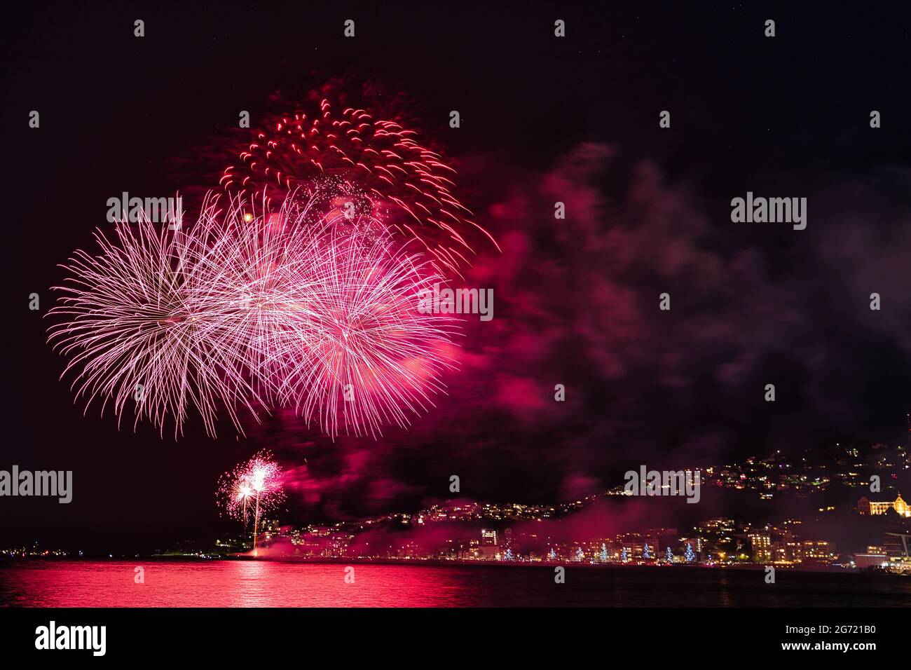 Wellington, New Zealand. 10th July, 2021. Fireworks light up the sky to ...