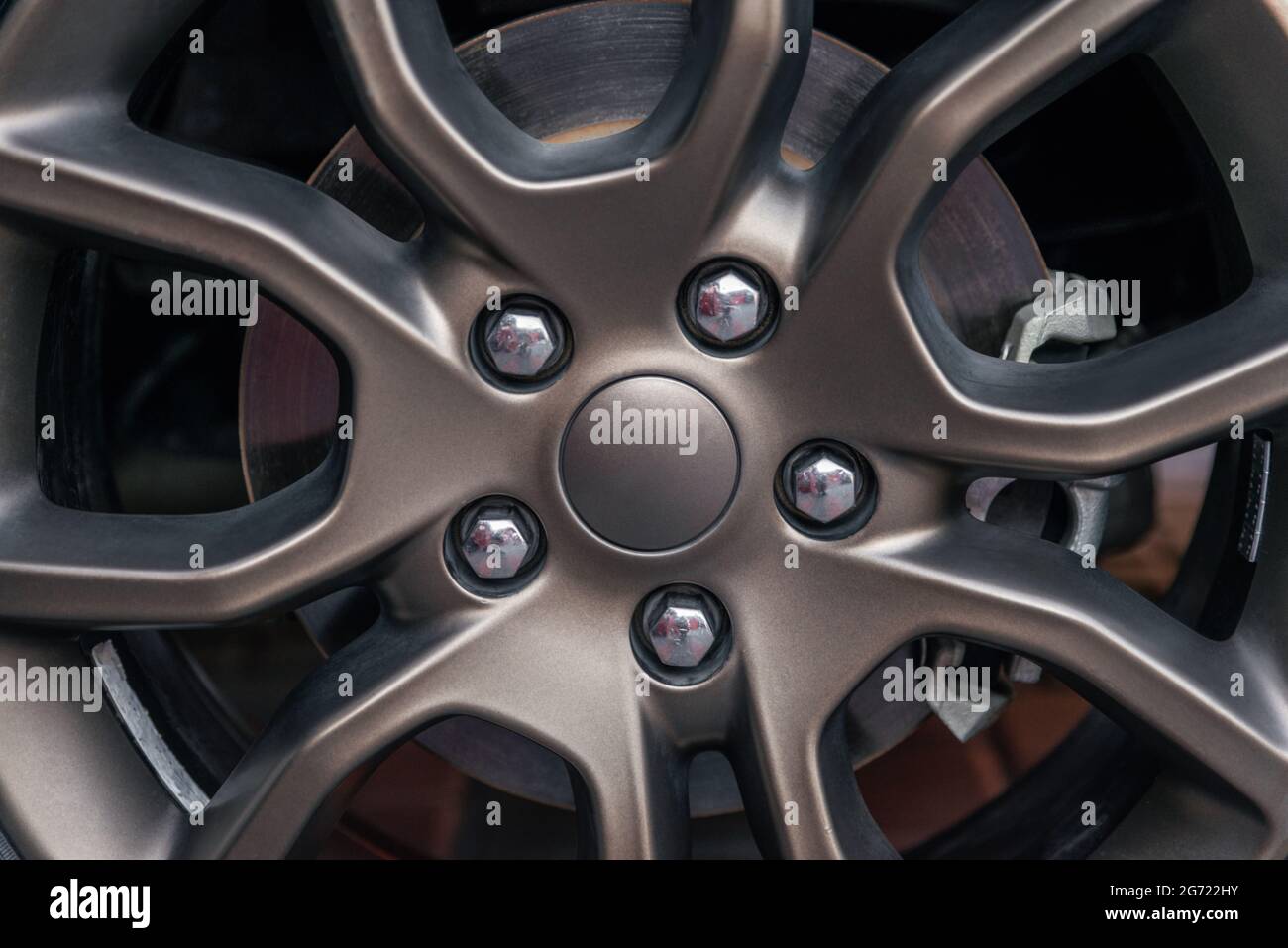 Beautiful alloy wheel close up. Metallic tire rim and disc brake ...