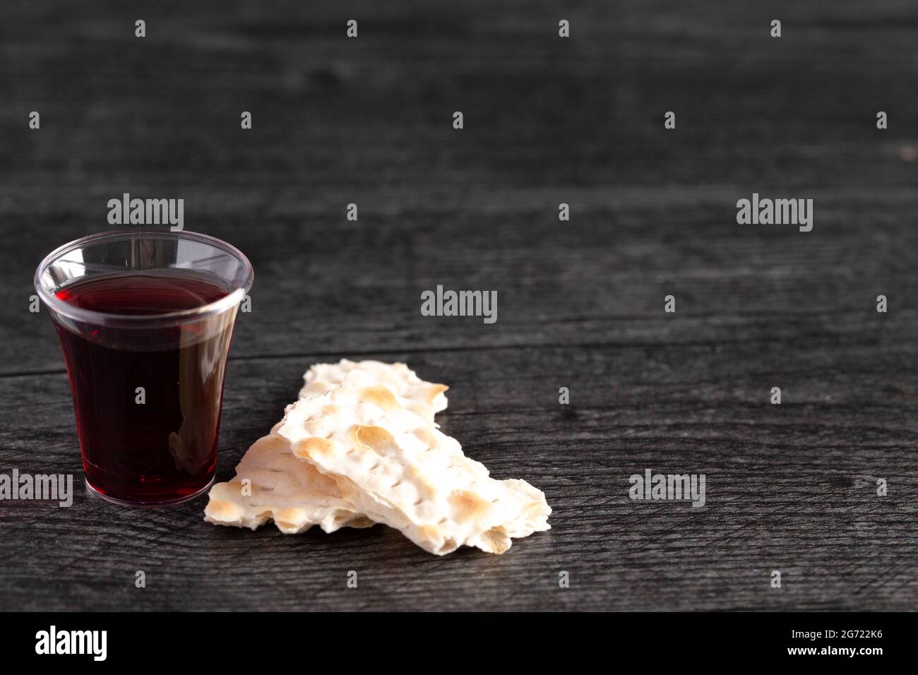 Elements of the Holy Communion or Lords Supper on a Dark Wood Table ...