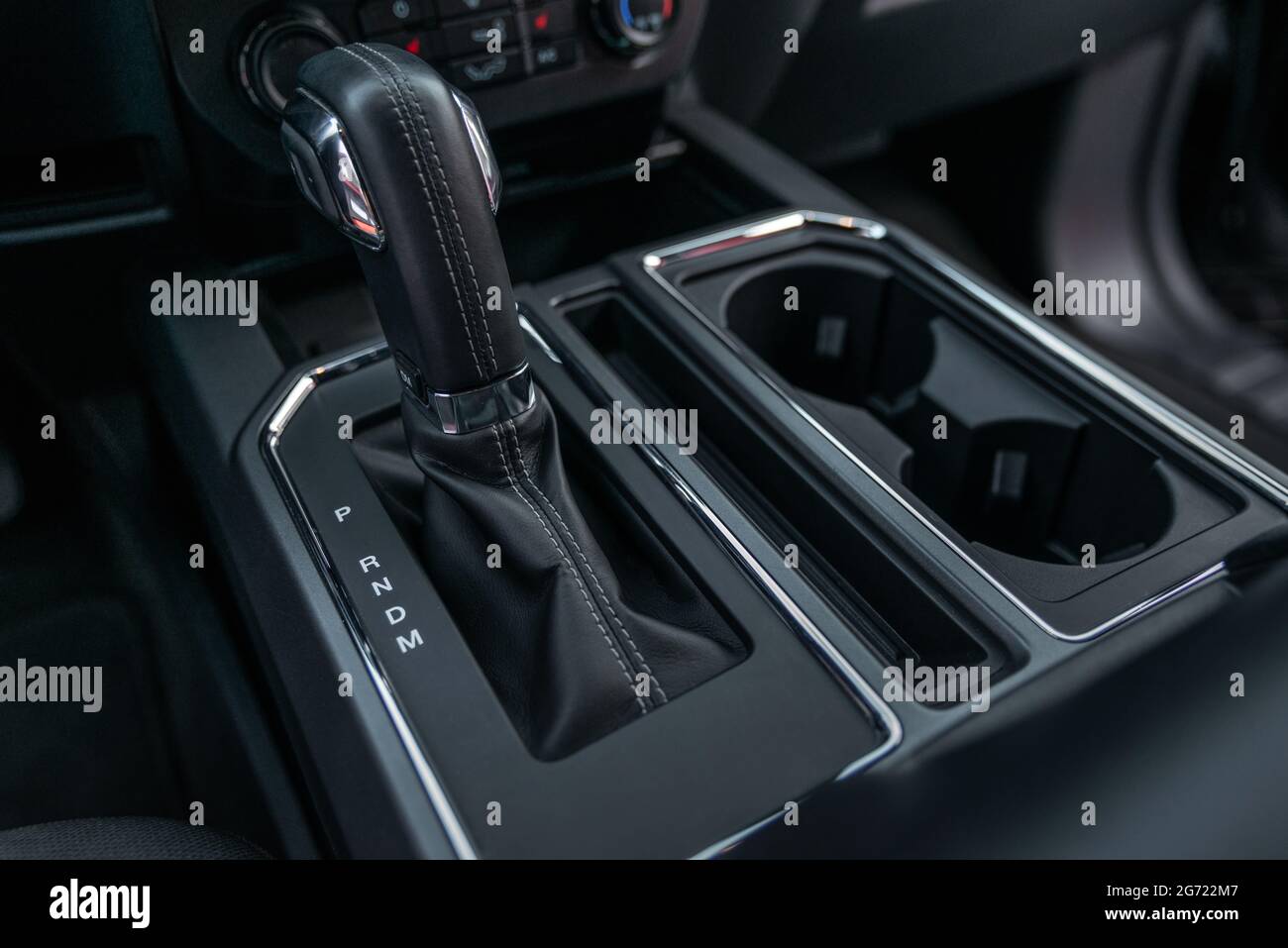 Detail of an automatic gear shifter in a new car close up. Interior of ...
