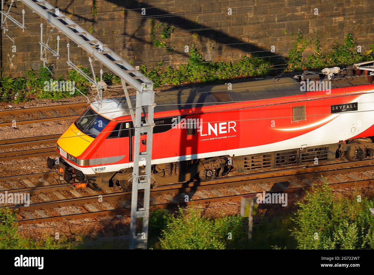 A London North Eastern Railway (LNER) train heading into Leeds through ...