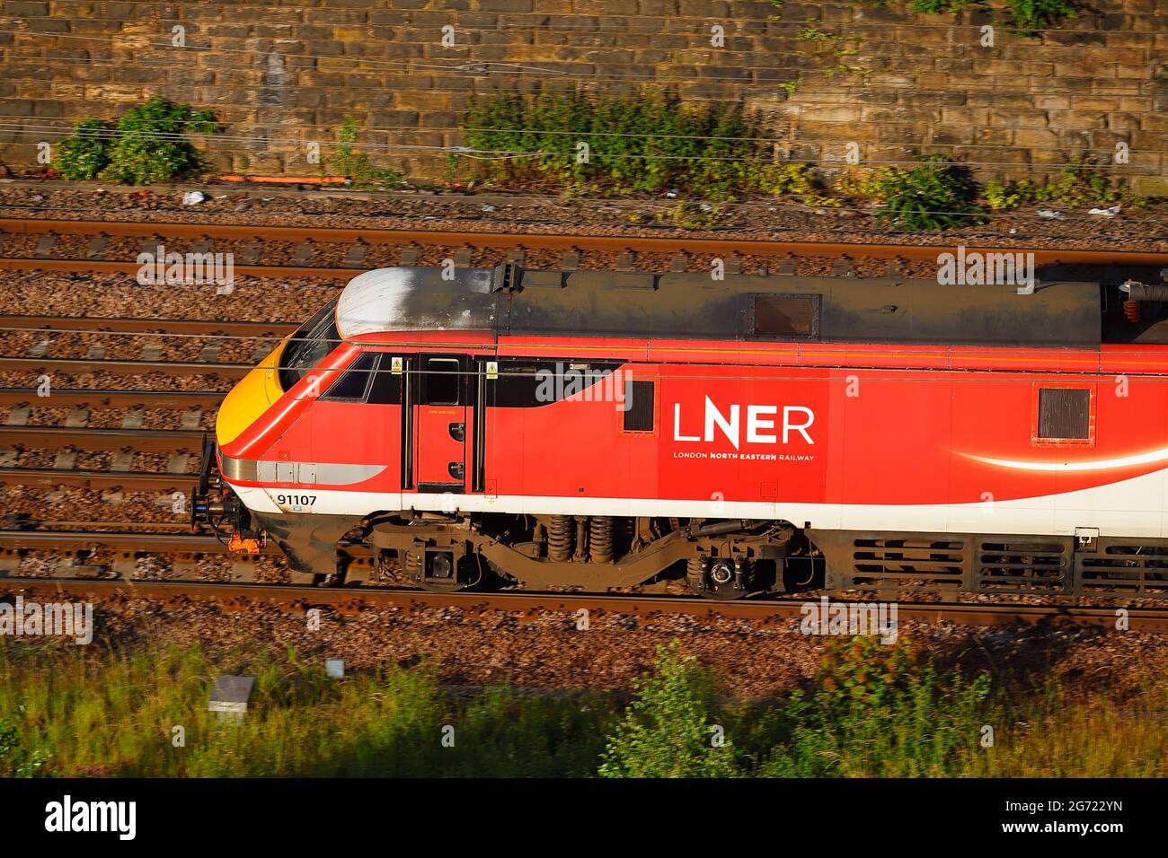 A London North Eastern Railway (LNER) train heading into Leeds through ...
