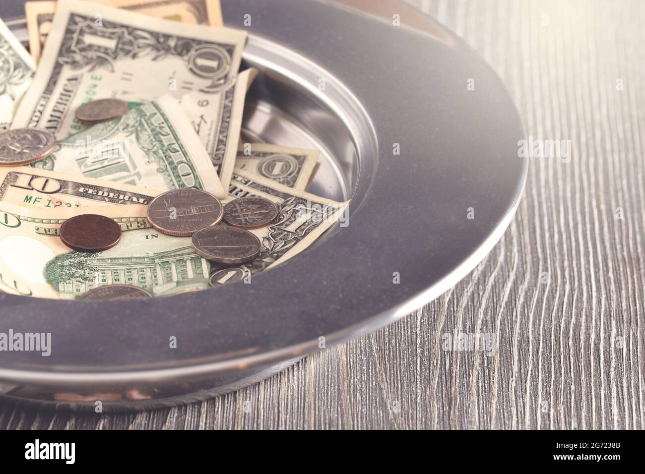 Offering plate church hi-res stock photography and images - Alamy