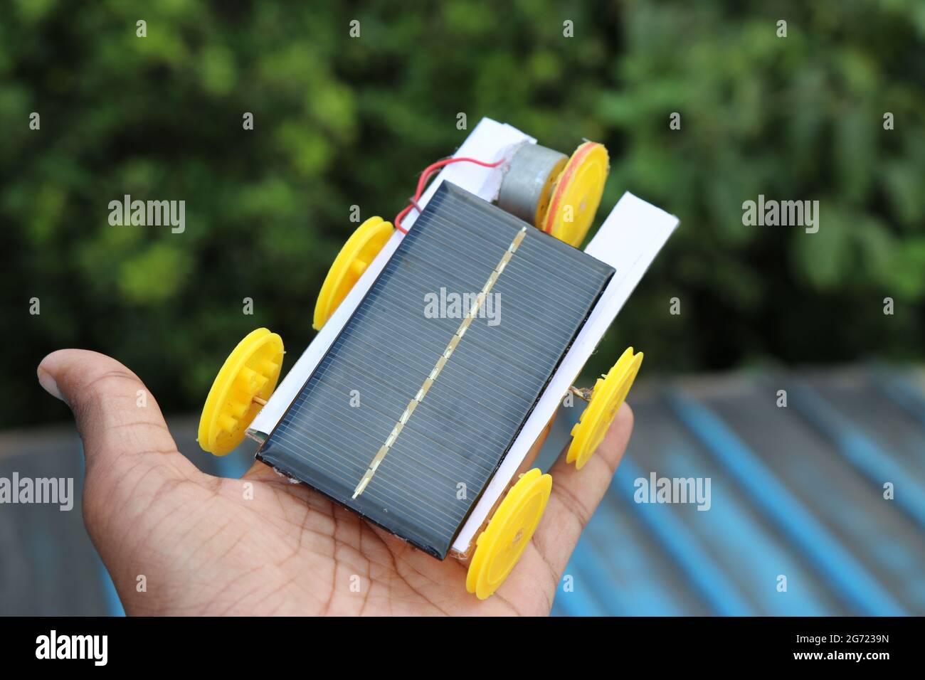 Unique solar powered car with 5 wheels and run by solar panel held in ...