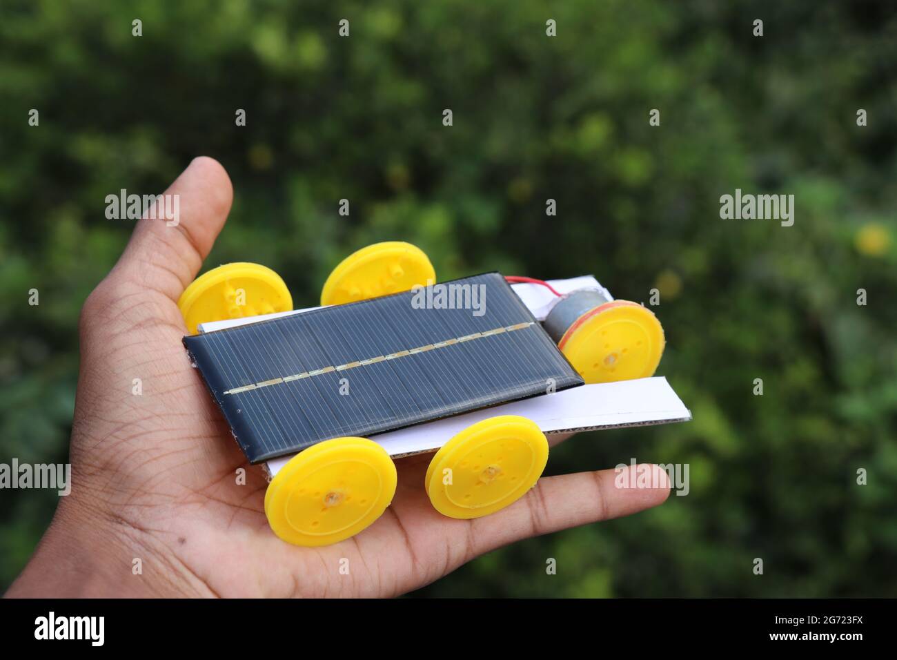 Solar car driven by single motor and connected to solar cells Stock ...