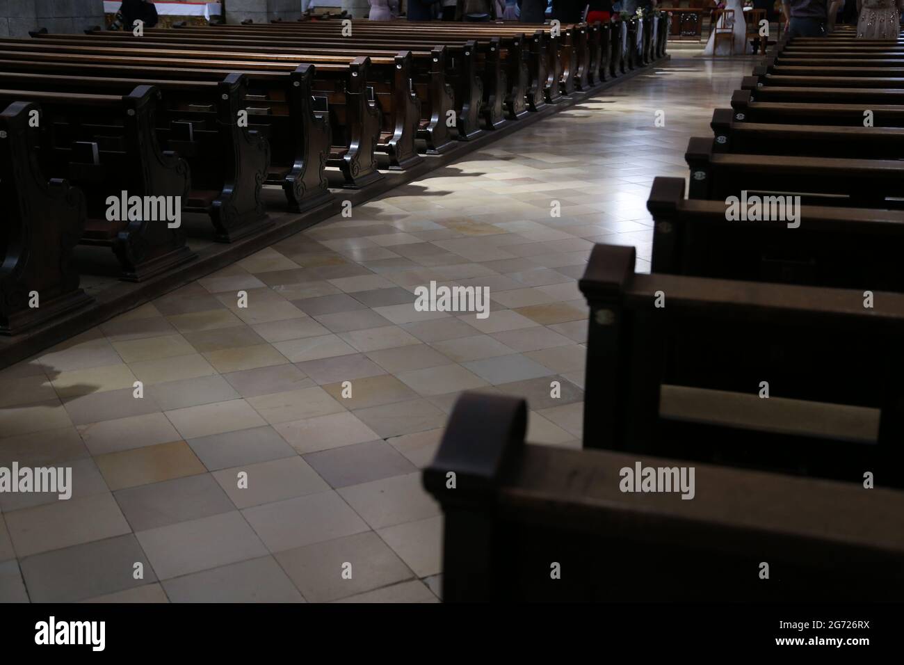 Empty church with wooden benches and aisle Stock Photo - Alamy
