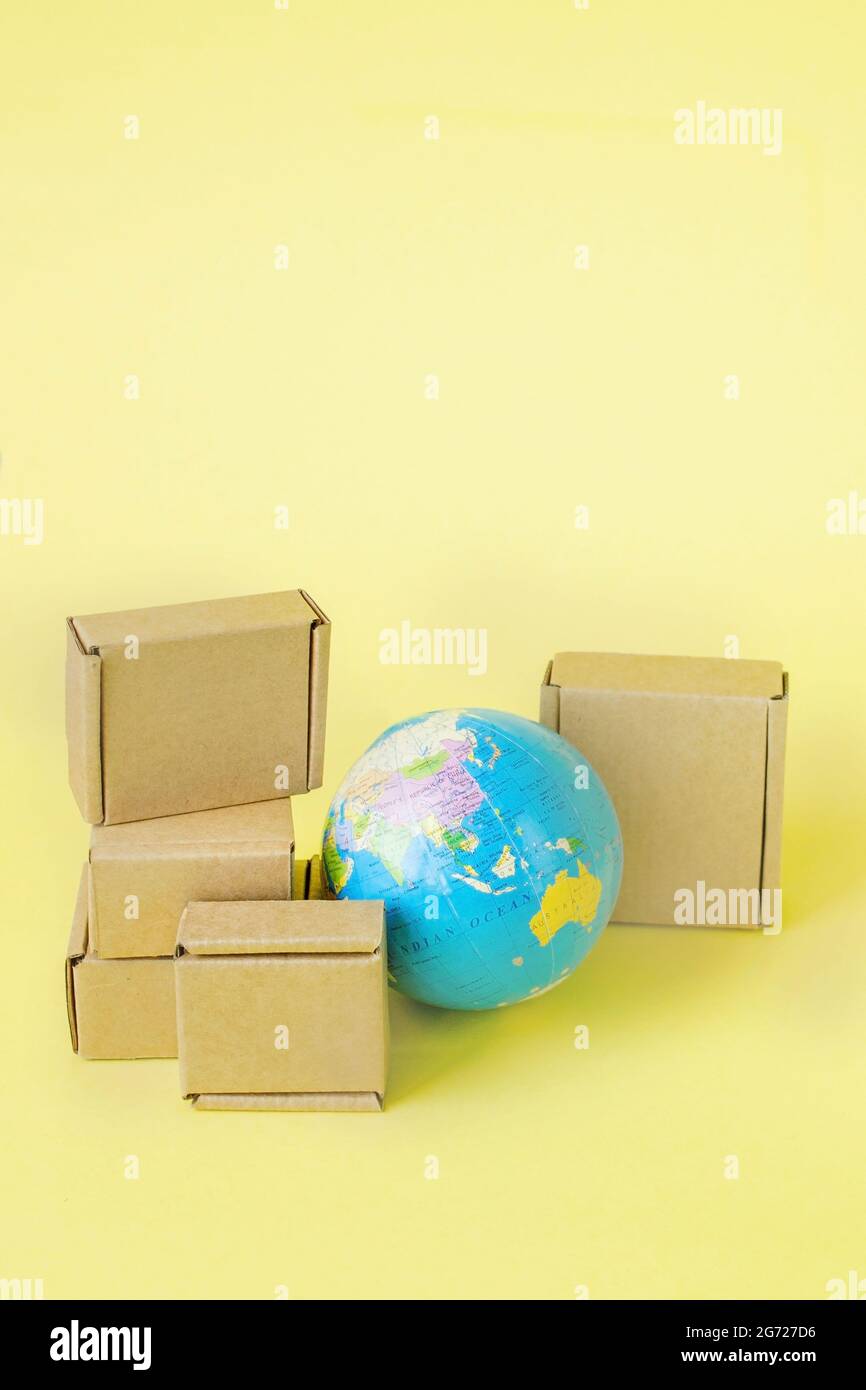 Earth globe is surrounded by boxes. Global business and international ...