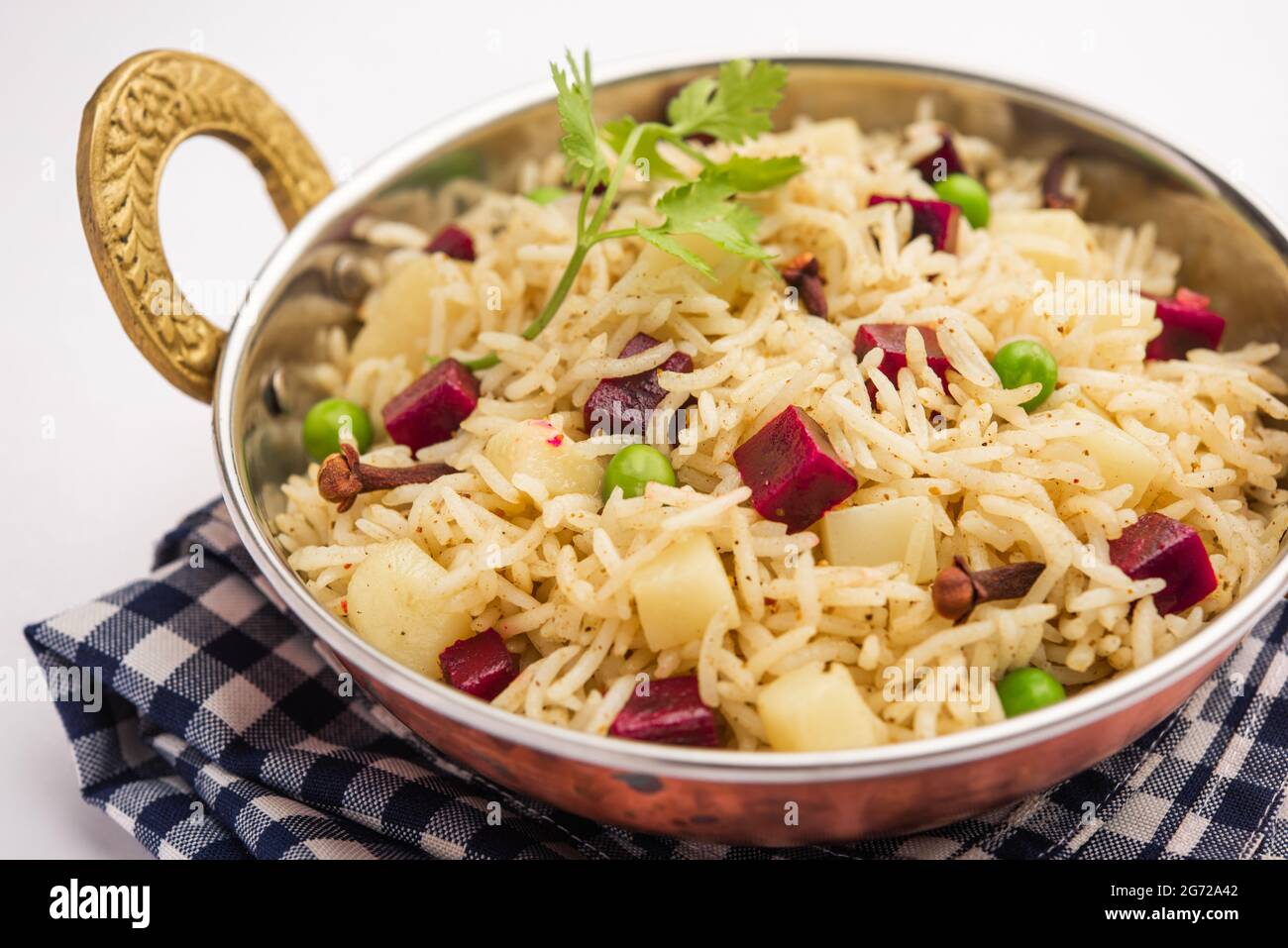 Beetroot Rice or pulao or pulav served in a bowl or karahi, selective ...
