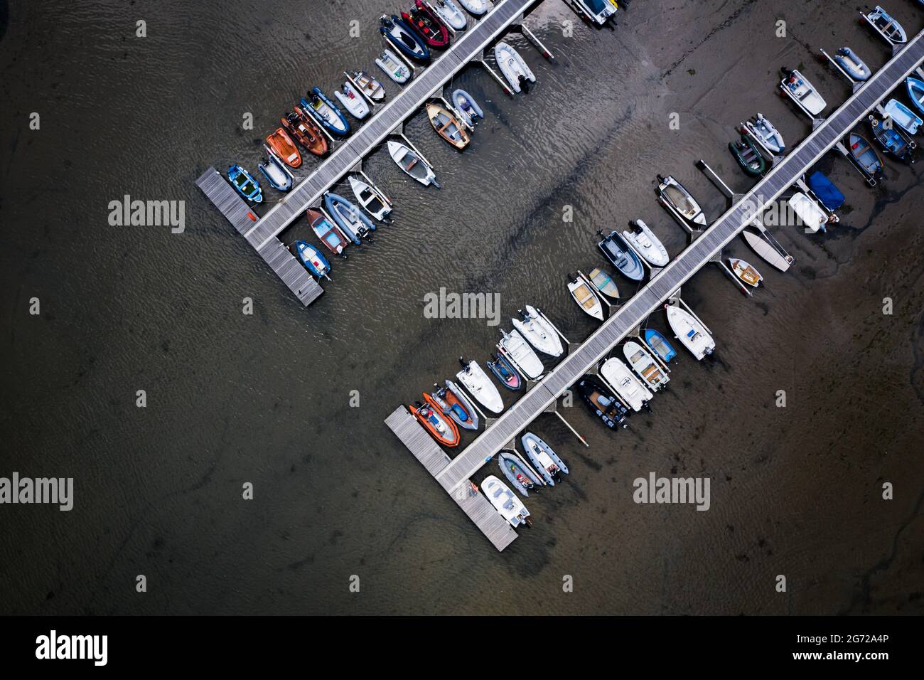 Aerial view of a the jetty of a sailing club in Helford, Cornwall full ...