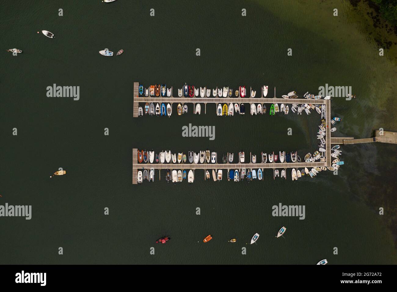 Aerial view of a the jetty of a sailing club in Helford, Cornwall full ...