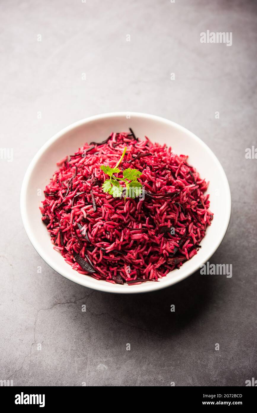Beetroot Rice or pulao or pulav served in a bowl or karahi, selective ...