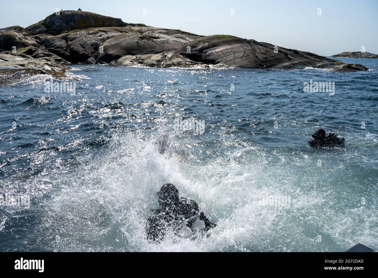 April 17, 2021 - Hamburgsund, Sweden: A scuba diver enters the water ...