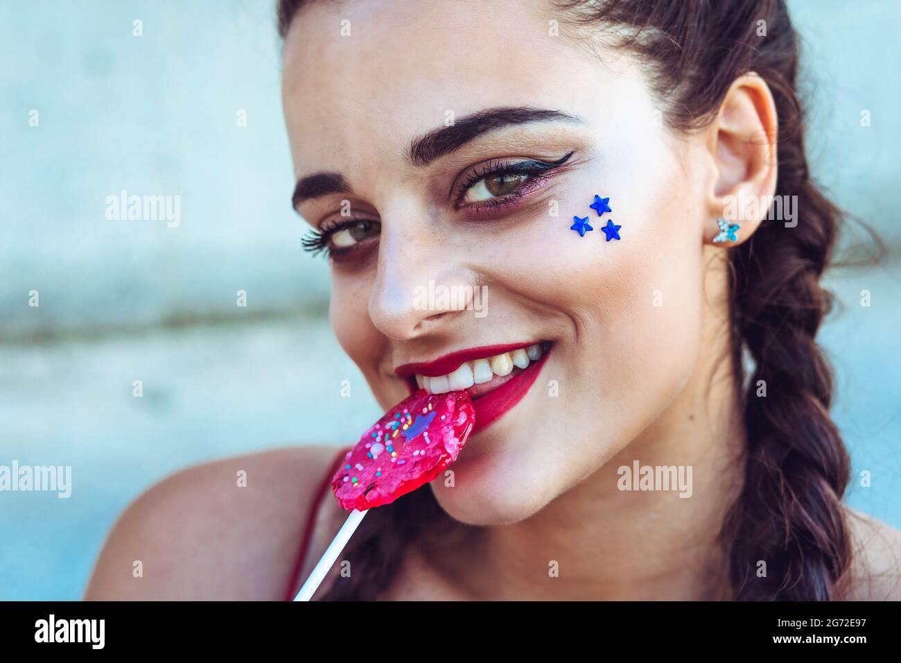 Close-up portrait of teen girl eats lollipop. Copy space Stock Photo ...