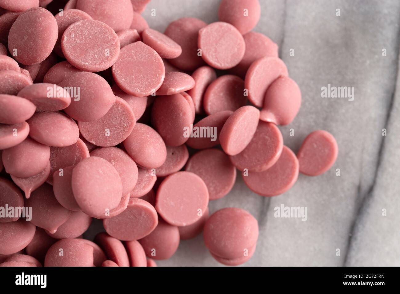 A Pile of Authentic Ruby Chocolate Drops on a Marble Counter Stock Photo - Alamy