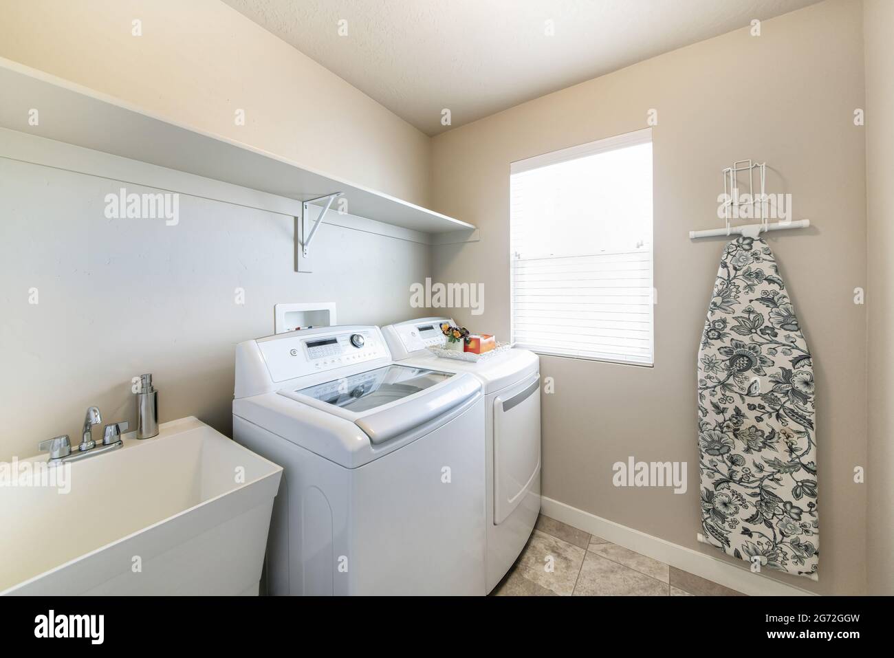 Simple laundry room interior with washing machines Stock Photo - Alamy
