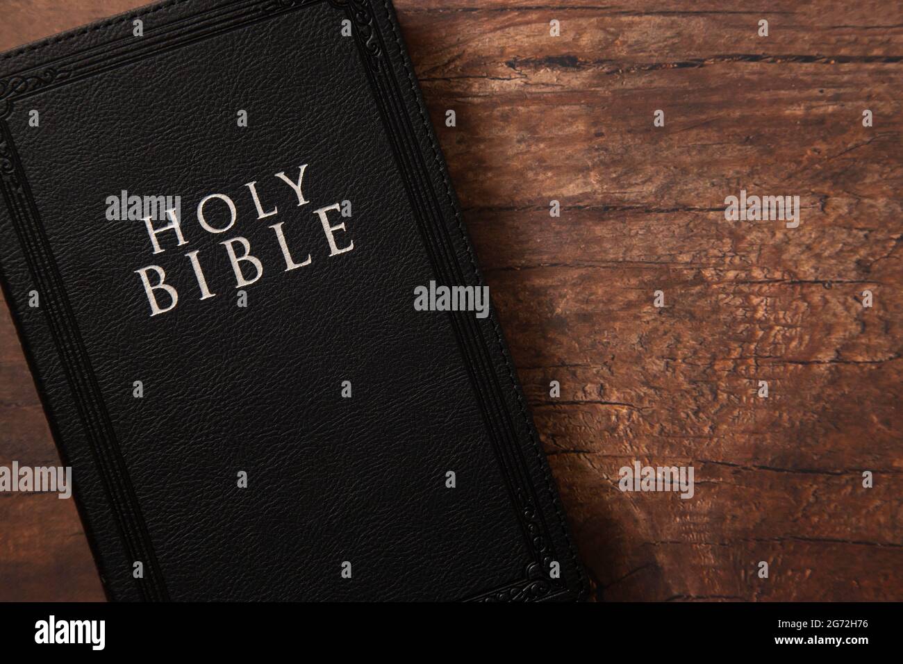 Holy bible on wood table hi-res stock photography and images - Alamy