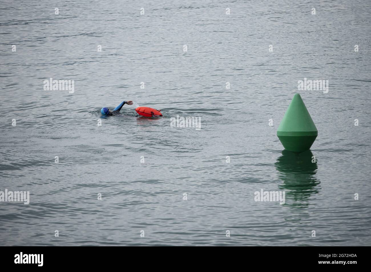 High angle shot of a scuba diver approaching the buoy in the sea Stock ...