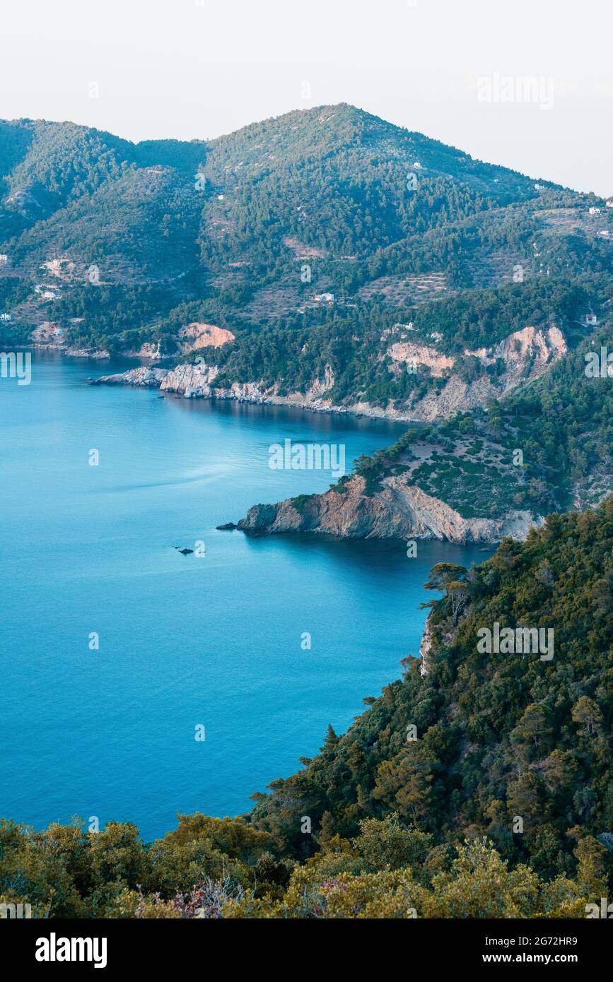Vertical view of a mediterranean coastline landscape, with an intense ...