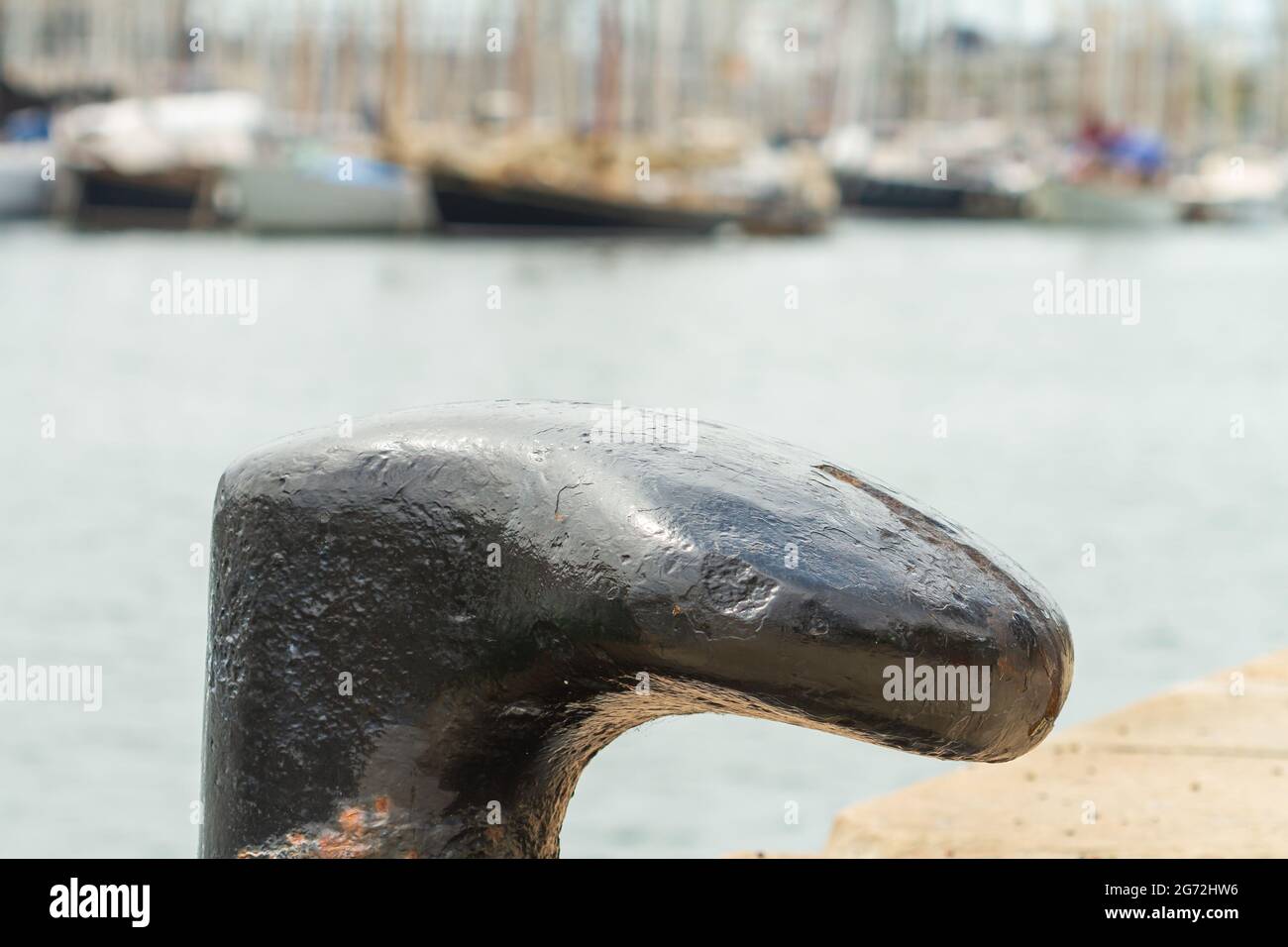 Closeup of iron pivot for mooring ships in the port Stock Photo - Alamy