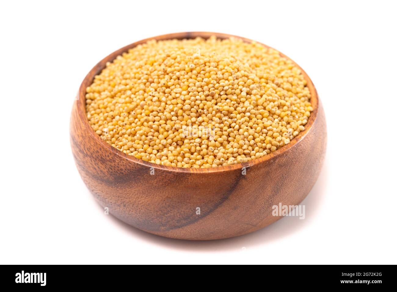 A Bowl of Whole Millet in a Wood Bowl Isolated on a White Background ...