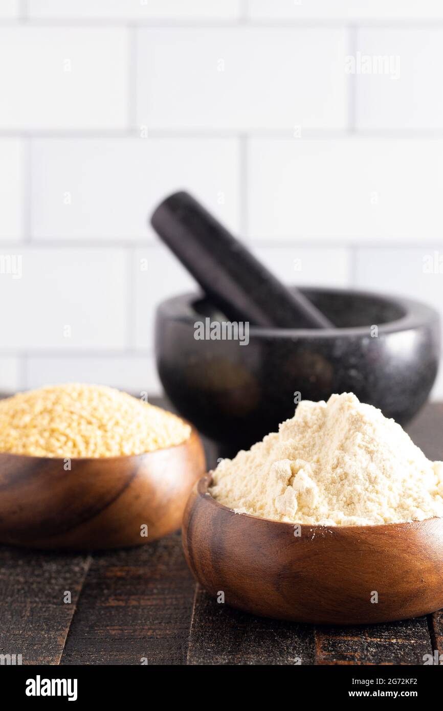 Bowls of Whole Millet and Millet Flour in Wood Bowls on a Dark Wood ...