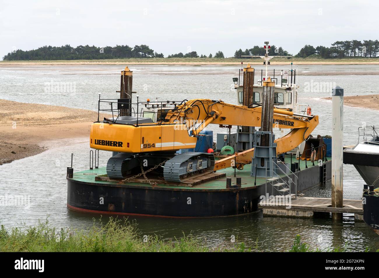 Excavator on a work barge Stock Photo - Alamy