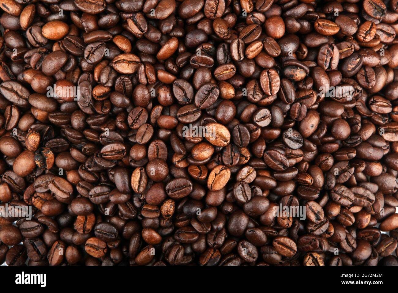 Closeup of fresh coffee beans background Stock Photo - Alamy