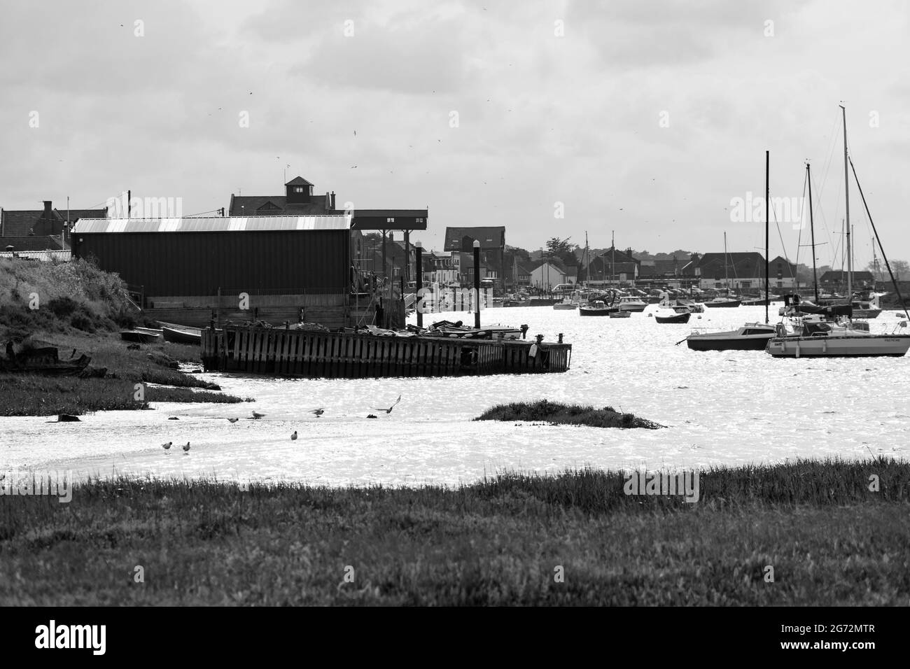 Boats moored in a coastal inlet Stock Photo - Alamy