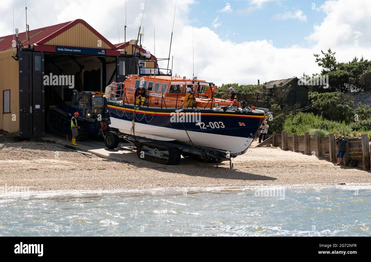 Small life boat being launched Stock Photo - Alamy