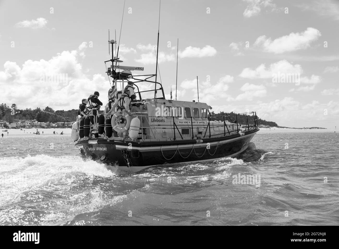 Rescue crew on boat Black and White Stock Photos & Images - Alamy