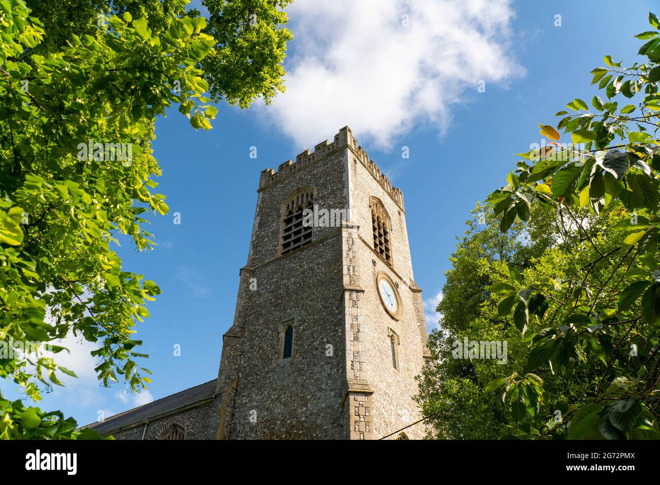 Tall square stone church tower Stock Photo - Alamy