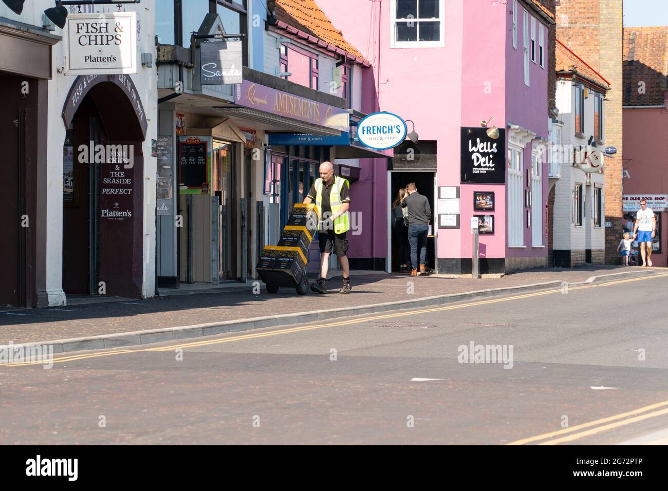 Man delivery boxes on a sack barrow Stock Photo - Alamy