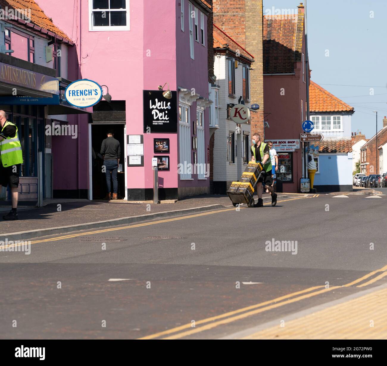 Man delivery boxes on a sack barrow Stock Photo - Alamy