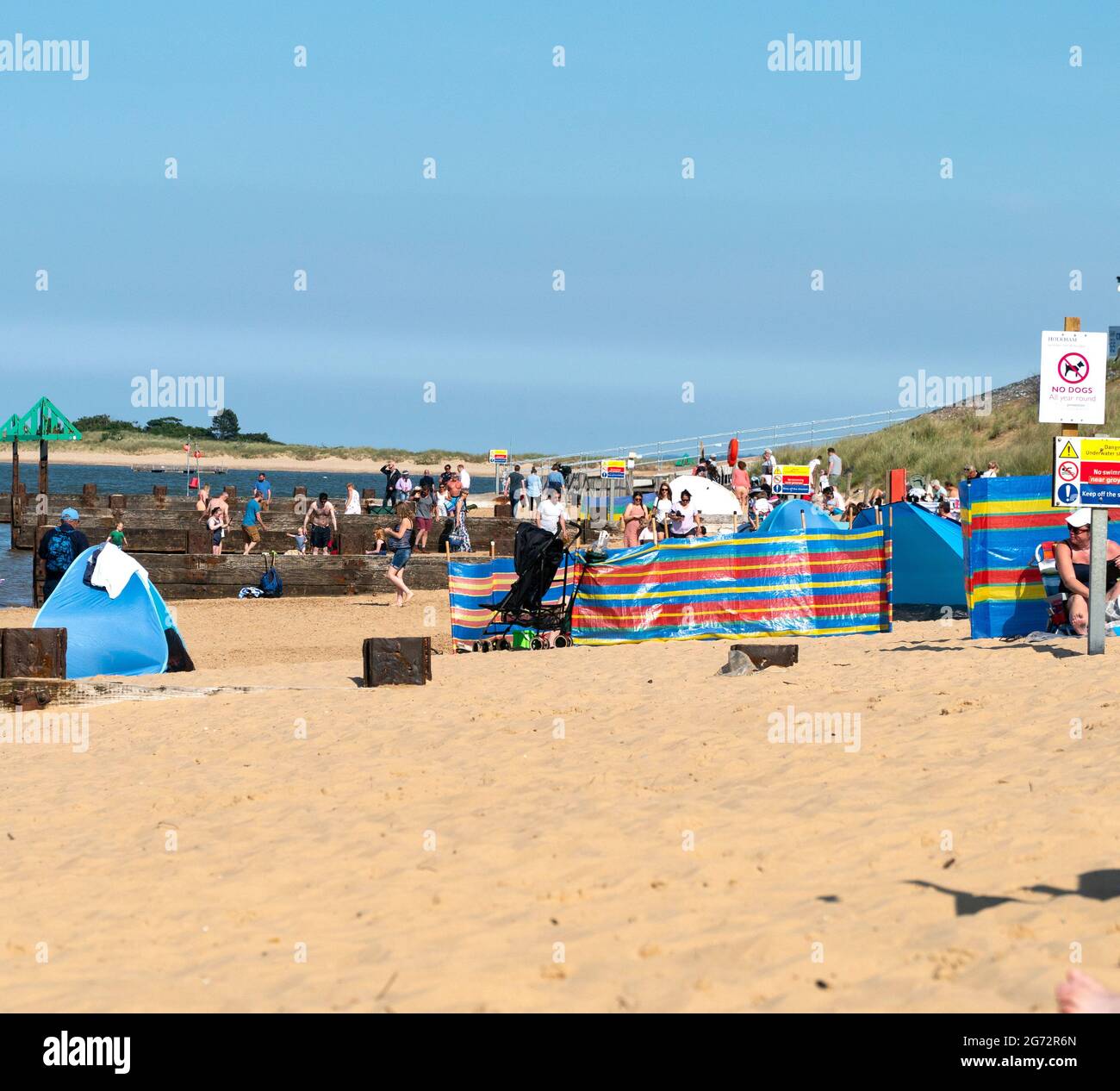Busy beach scene on the North Norfolk coast, UK Stock Photo - Alamy