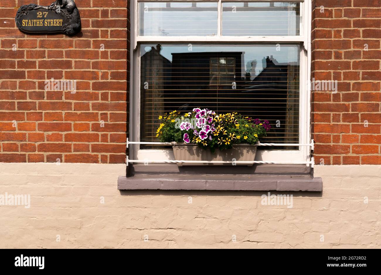Flowers in a window box example Stock Photo - Alamy