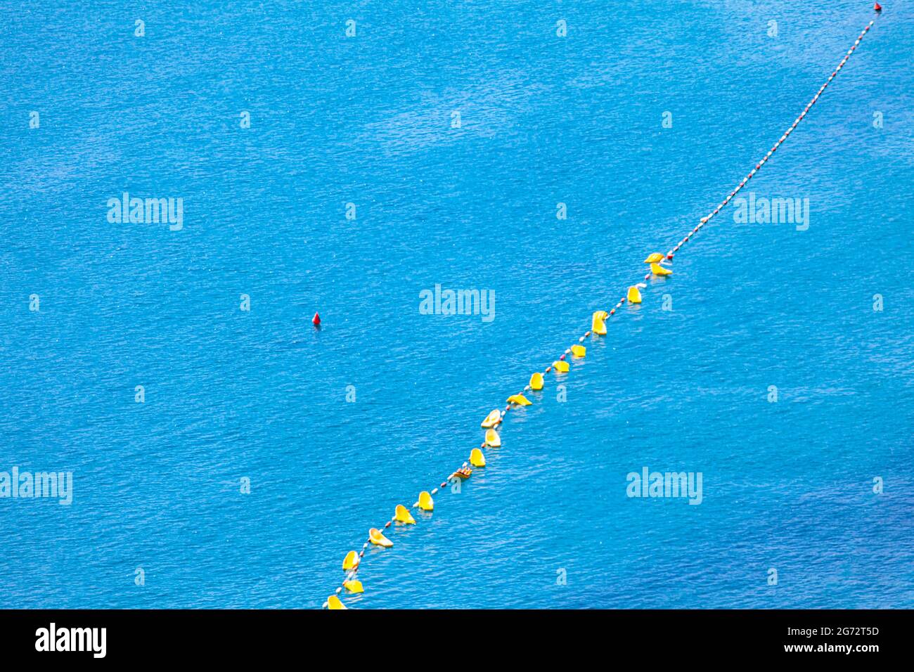 Swimming marker in the sea . Beach buoys in blue water Stock Photo - Alamy