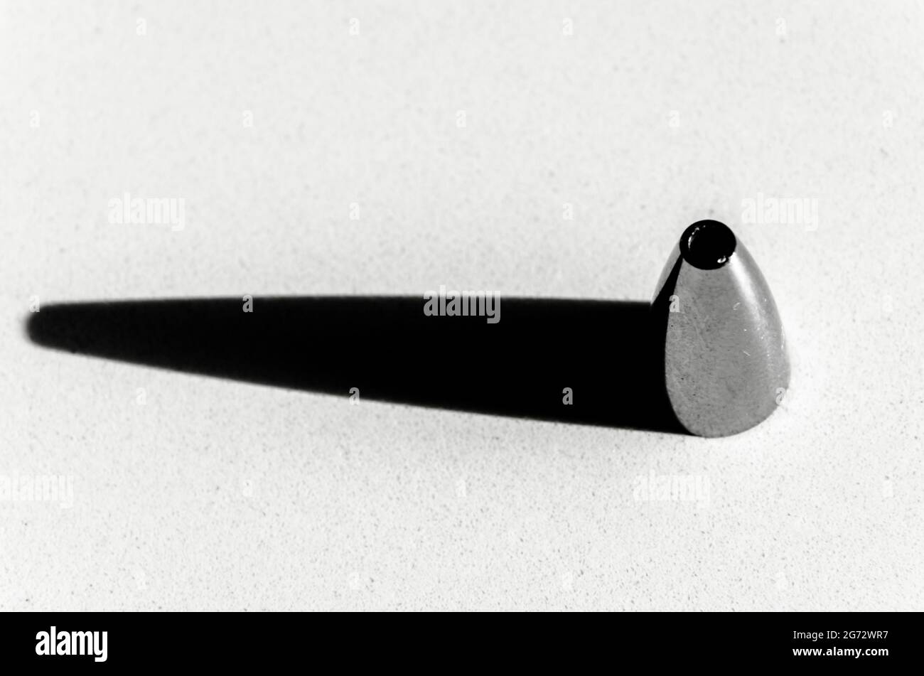 Top view of a funnel form metal with black horizontal shadow on white ...