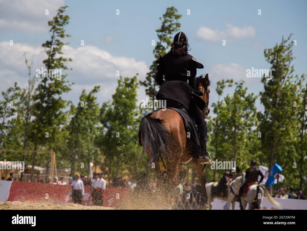 Equestrian riding a horse in an arena Stock Photo - Alamy