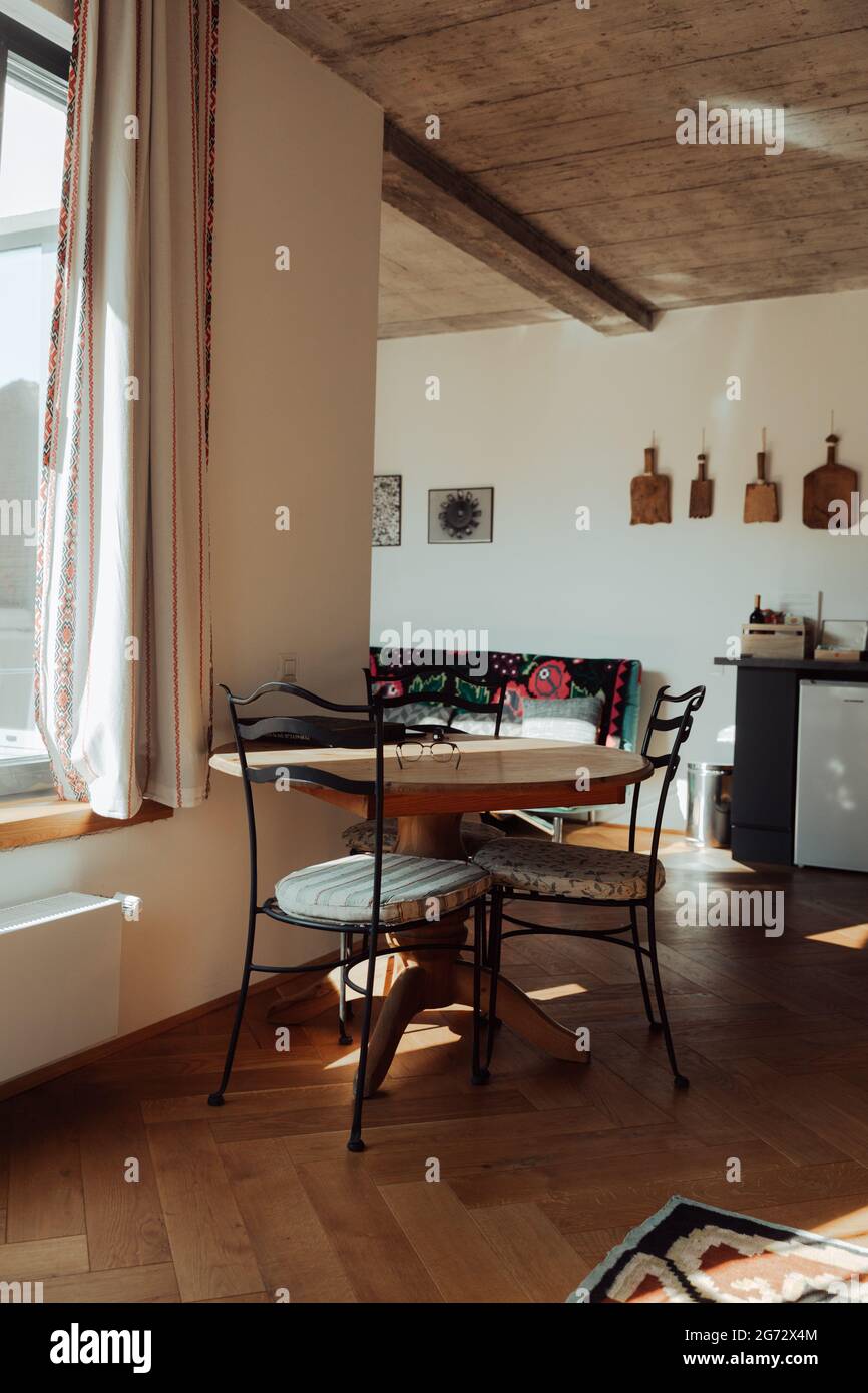 Interior of a loft-style room with table and chairs and retro ...