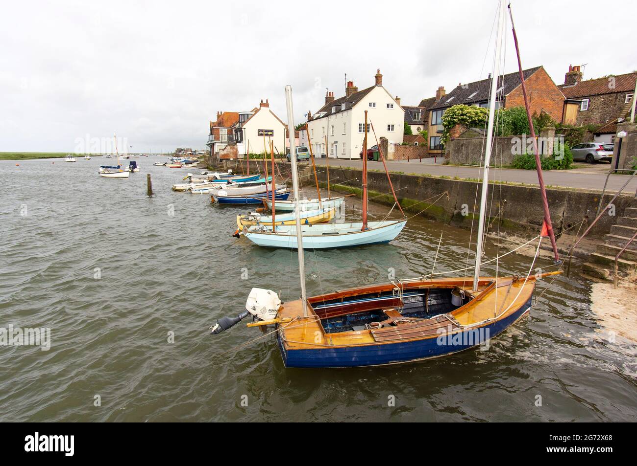 Small sail boats moored on a small quayside Stock Photo - Alamy