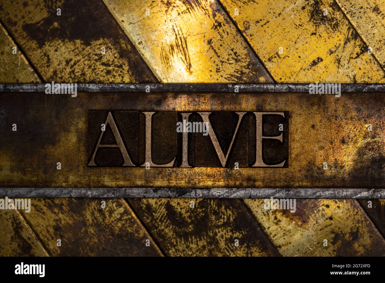 Alive text on vintage textured grunge copper and gold background Stock ...