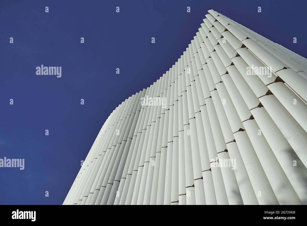 View of the futuric building. White slats against the blue sky ...