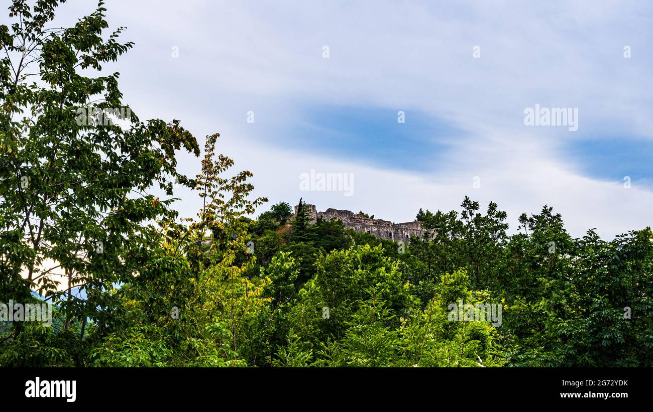 view of the medieval castle of Laviano, Italy. with trees and forest ...