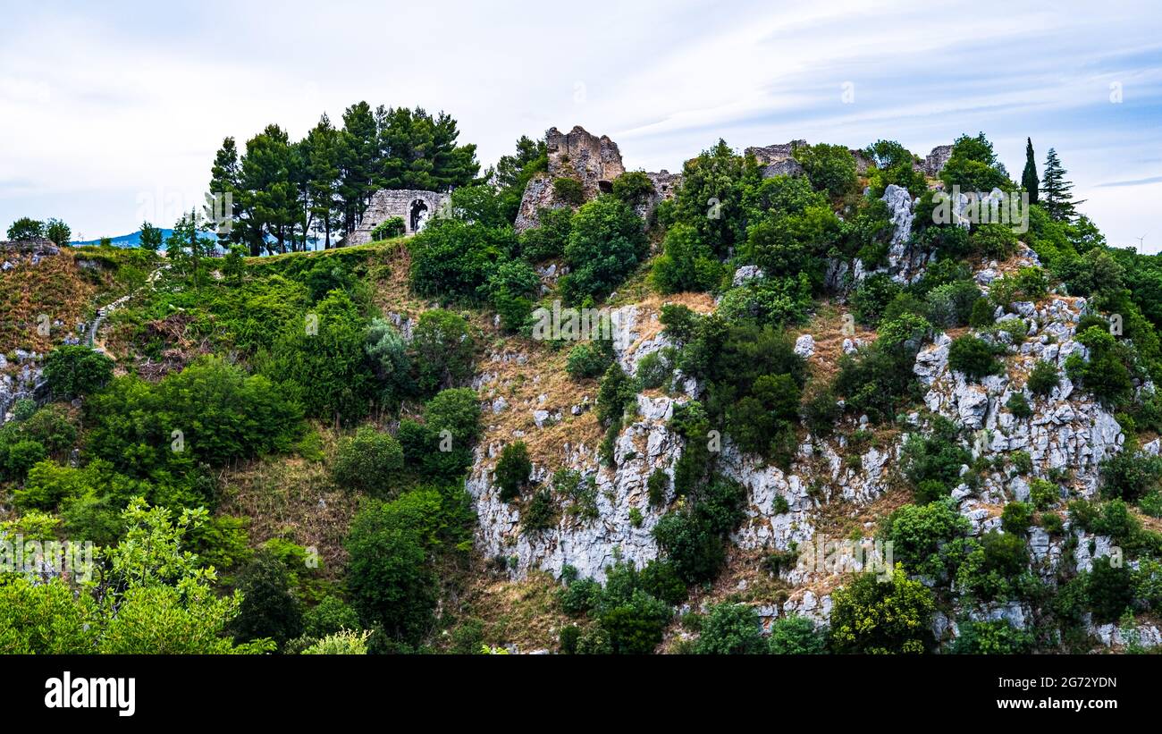 view of the medieval castle of Laviano, Italy. with trees and forest ...