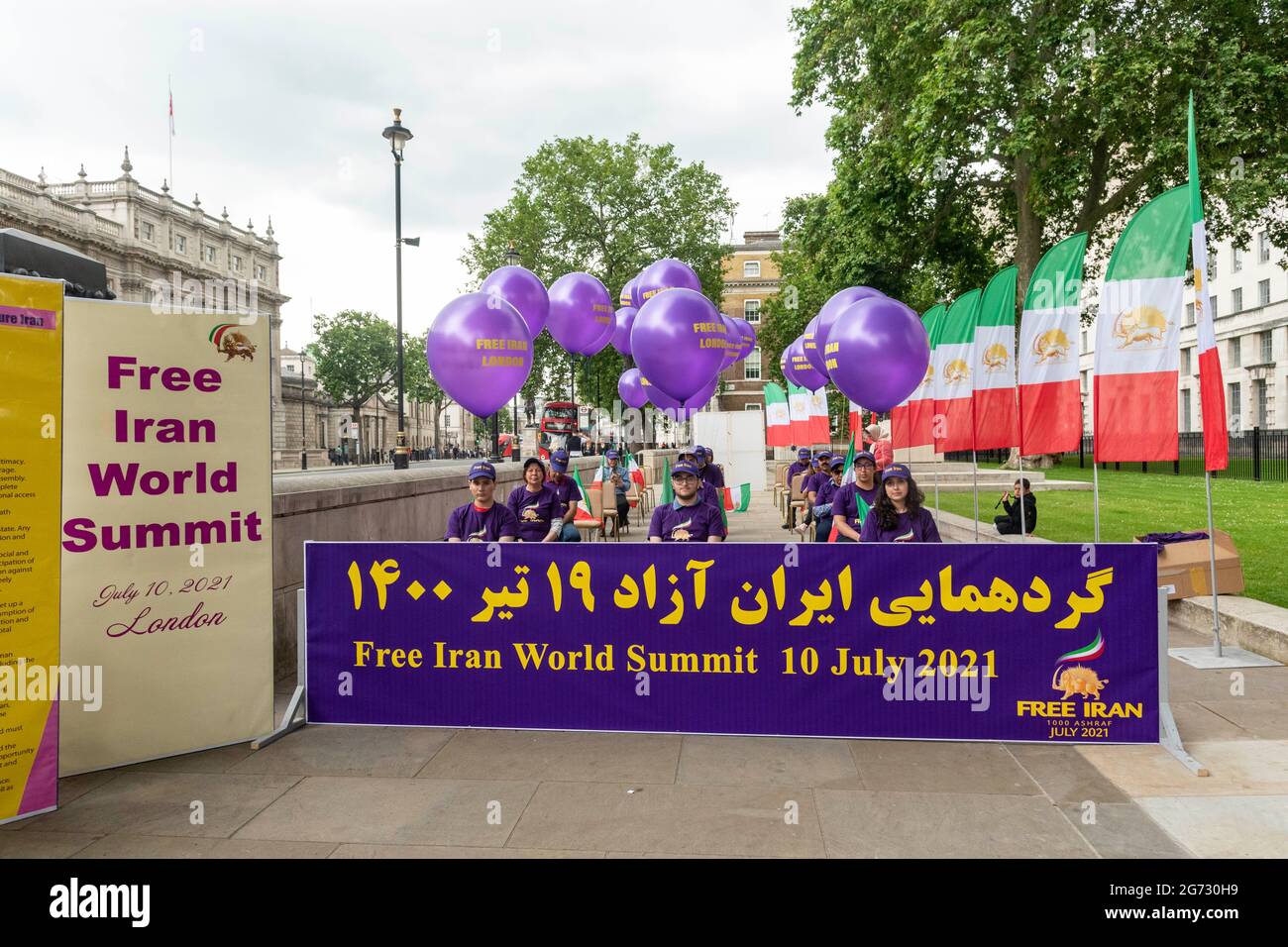 Activists wearing Free Iran T-shirts and caps prepare to watch the ...