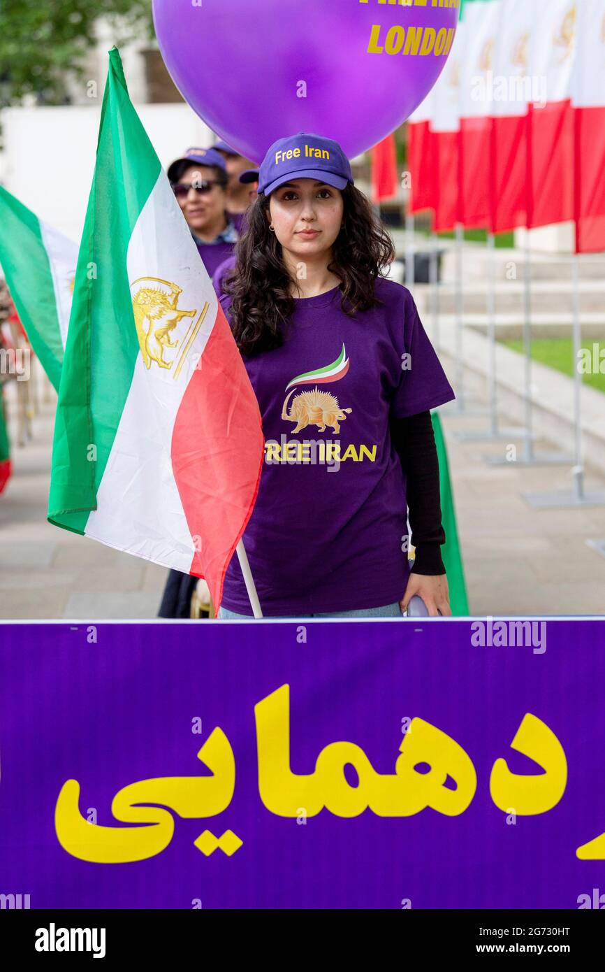 An activist holds a flag of Iran before a live screening of the largest ...