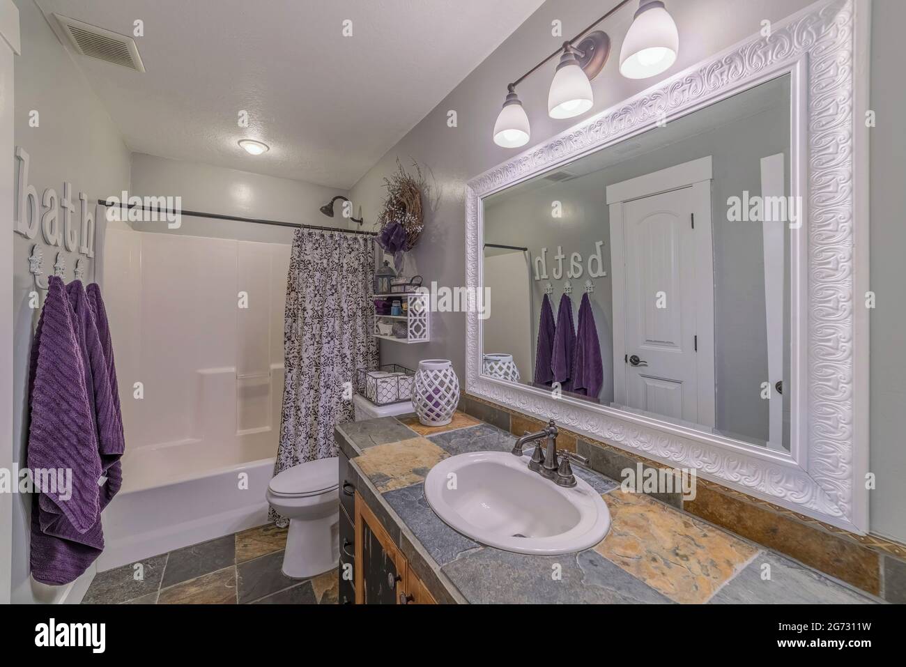 Bathroom of a modern apartment with white furniture Stock Photo - Alamy