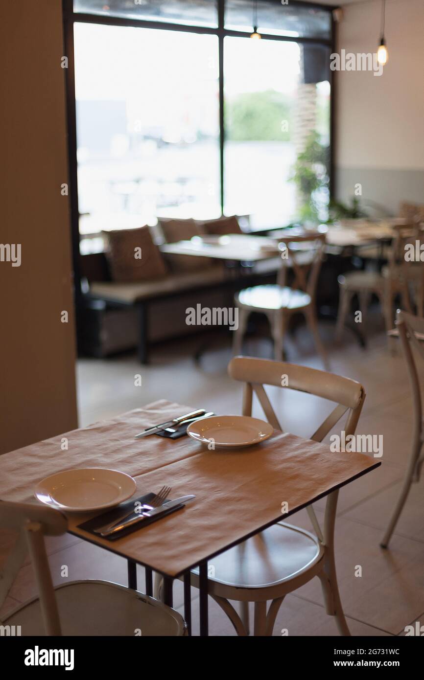 cozy place. a table inside an Italian restaurant with serving plates ...