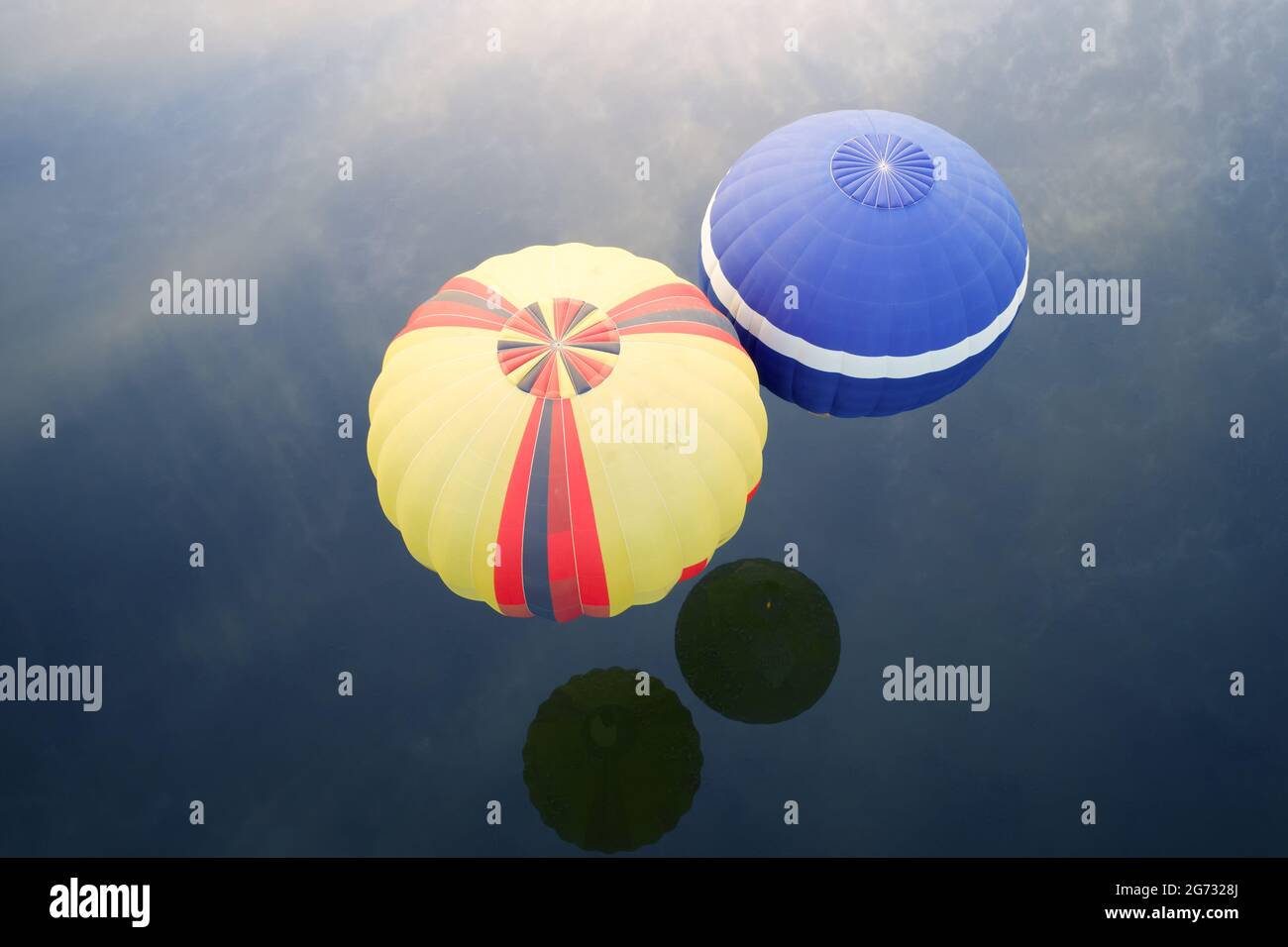 Two balloons over the water. Top view Stock Photo - Alamy